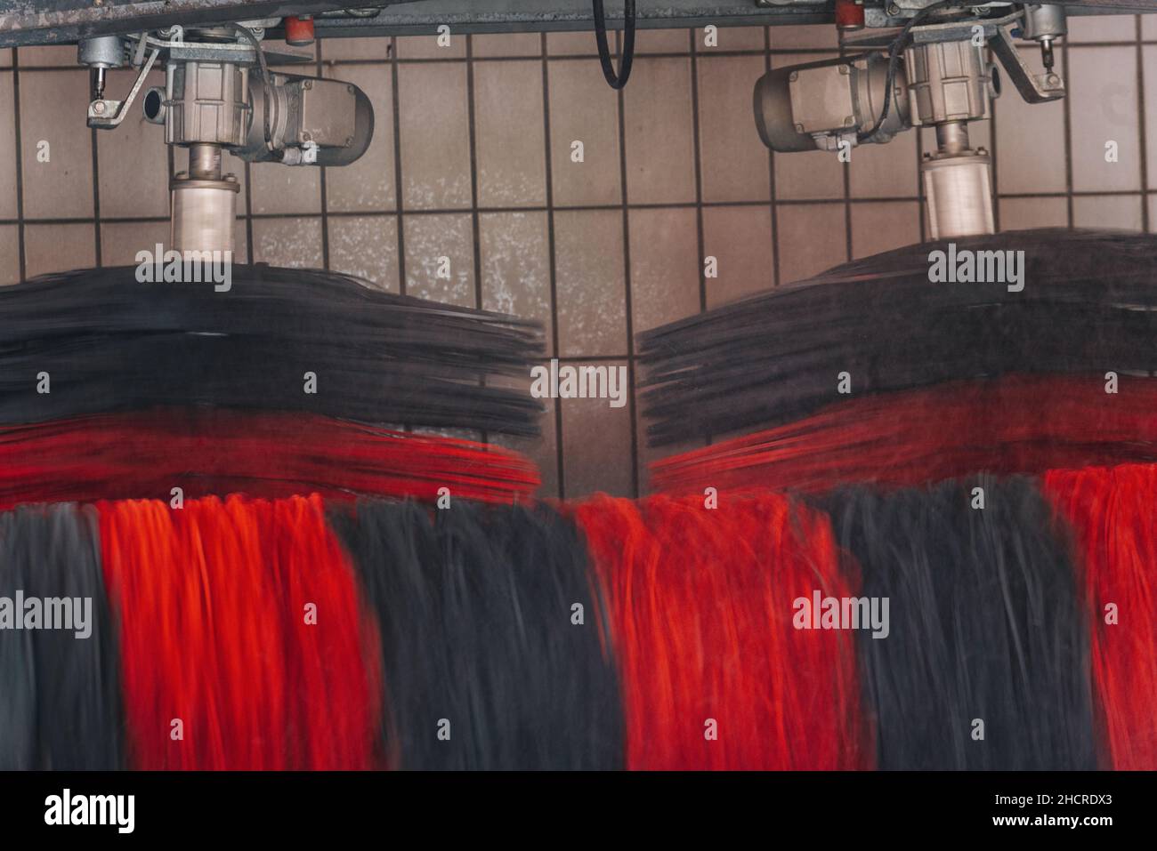 Automatic car wash brushes in action Stock Photo - Alamy