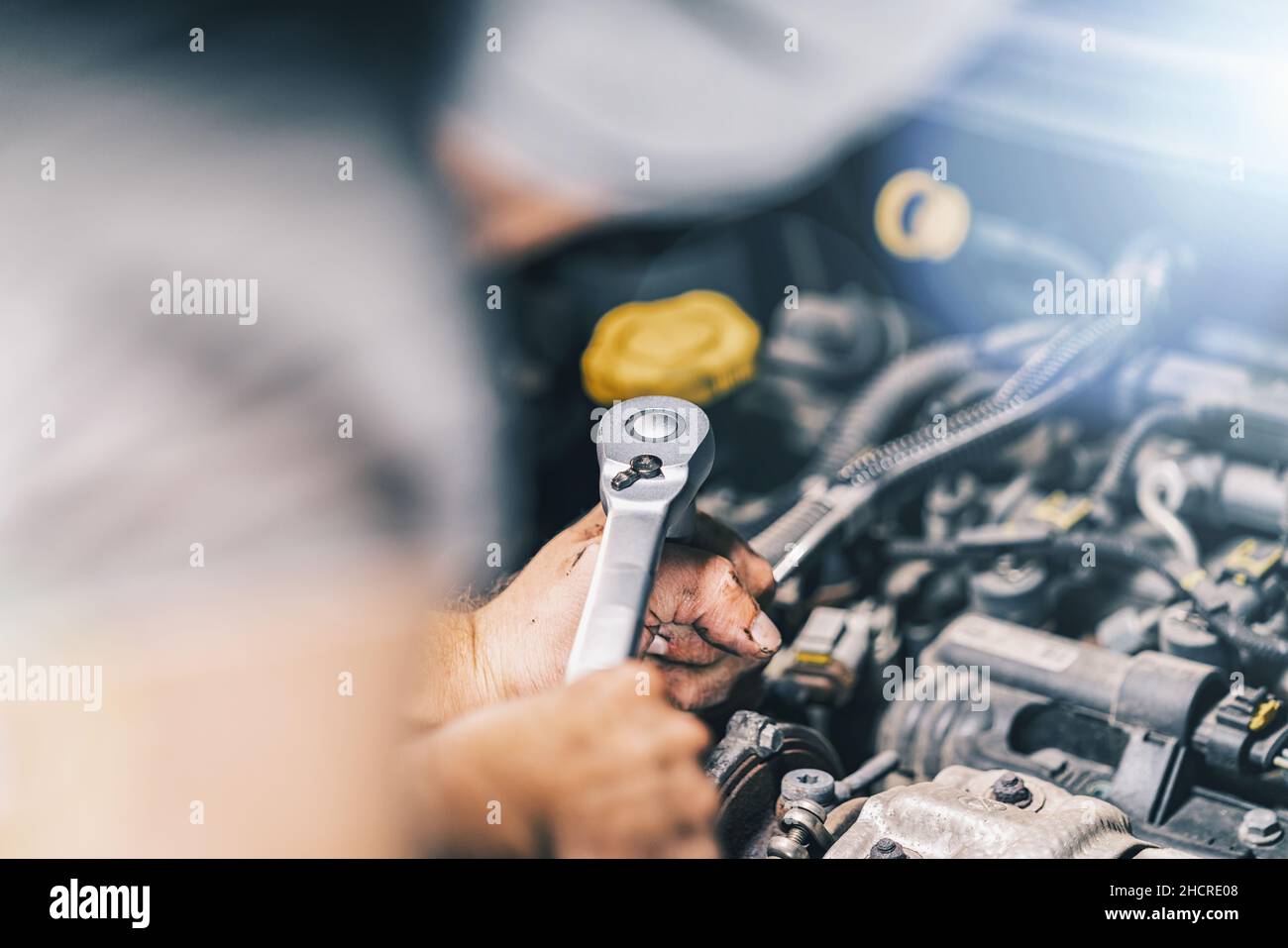 DIY Auto mechanic working in garage with wrench Stock Photo - Alamy