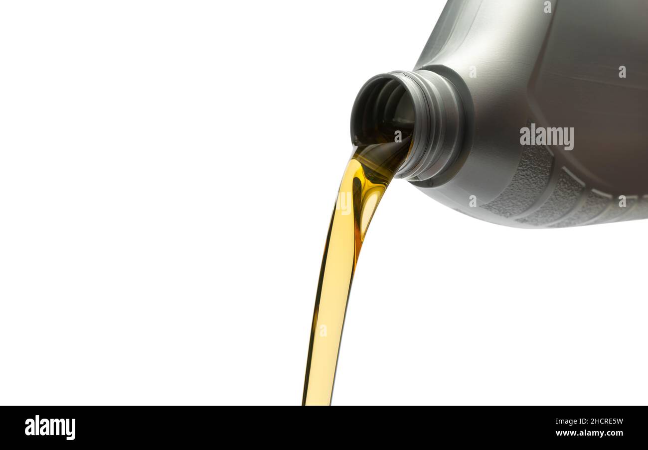 hand Pouring oil lubricant motor car from a bottle on isolated white background Stock Photo - Alamy