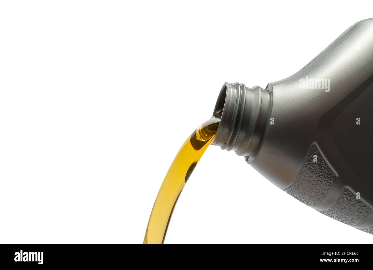 Pouring oil lubricant motor car from silver bottle on isolated white background Stock Photo - Alamy