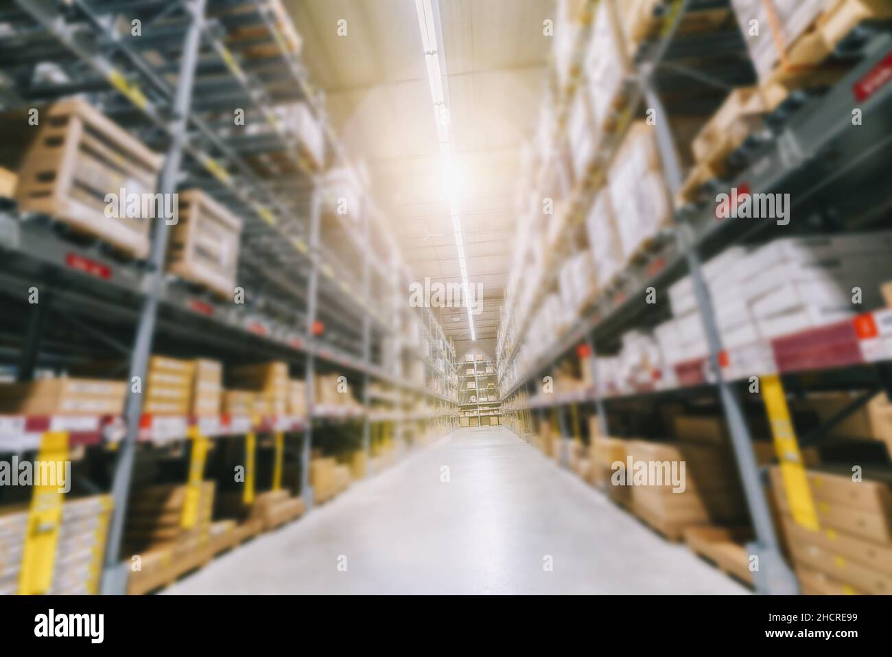 Large cargo warehouse shelves virtual focus background Stock Photo - Alamy