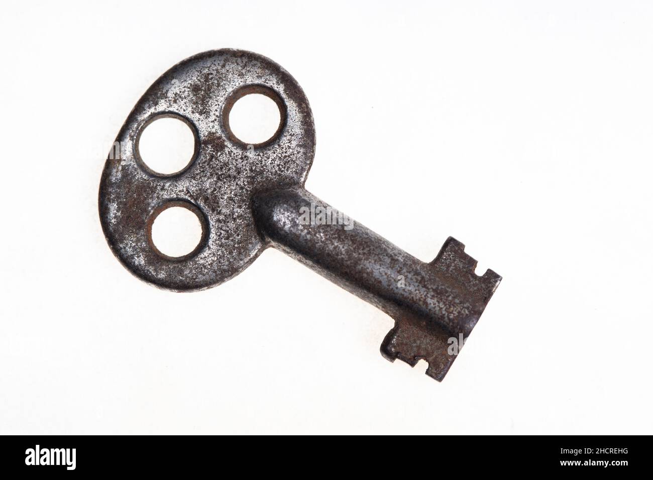 Old rusty key isolated on a white background Stock Photo - Alamy