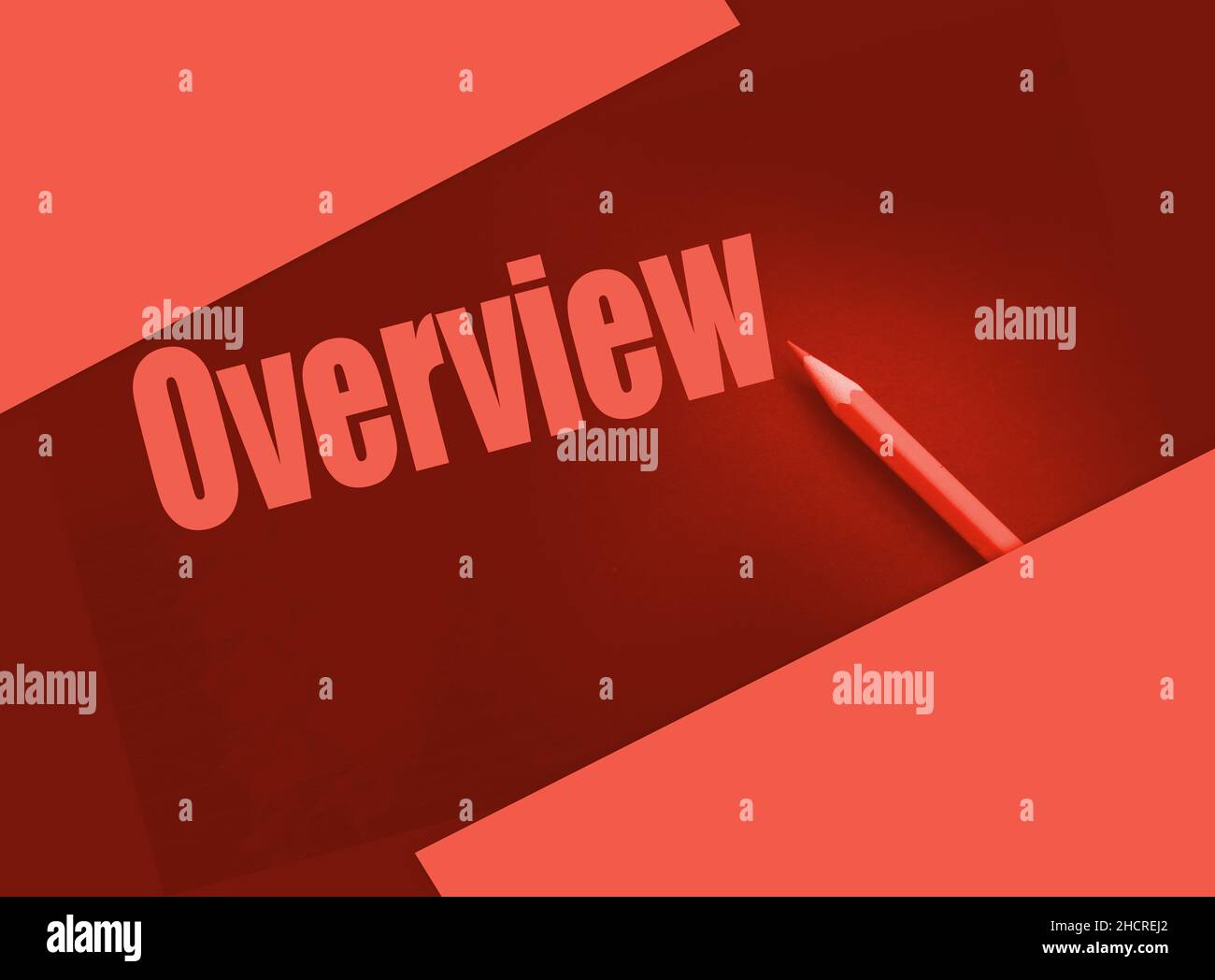 OVERVIEW word printed in yellow ink on black paper and pencil besides ...