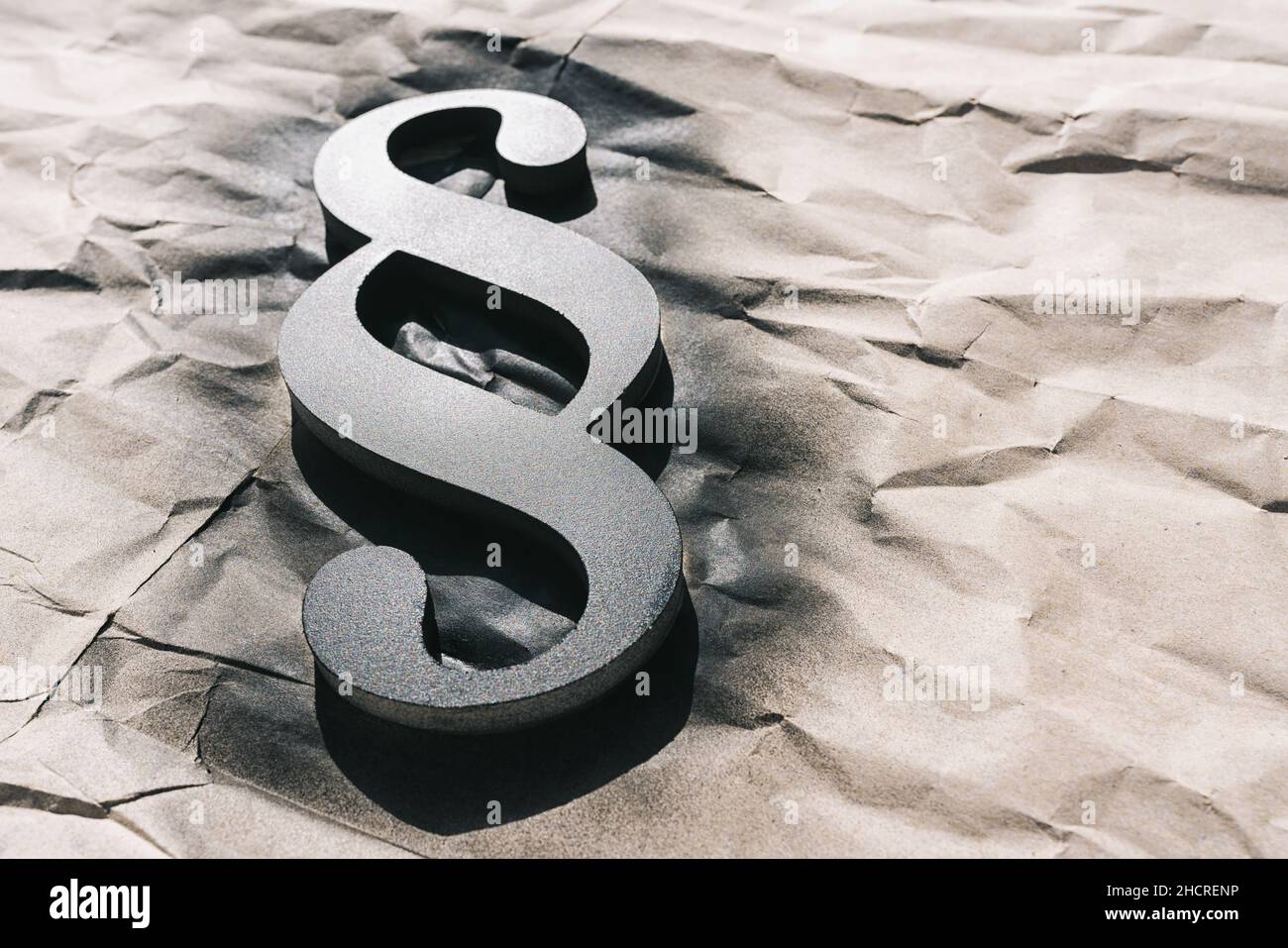 Paragraph sign - Symbol of Law and Justice on crumpled paper Stock ...