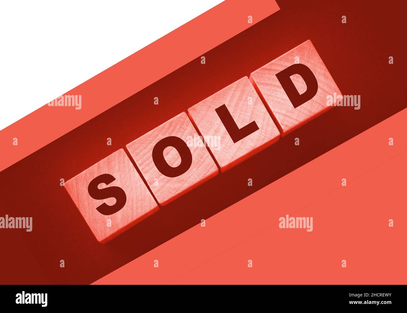 Sold Word Written In Wooden Cubes on black background. Real estate ...