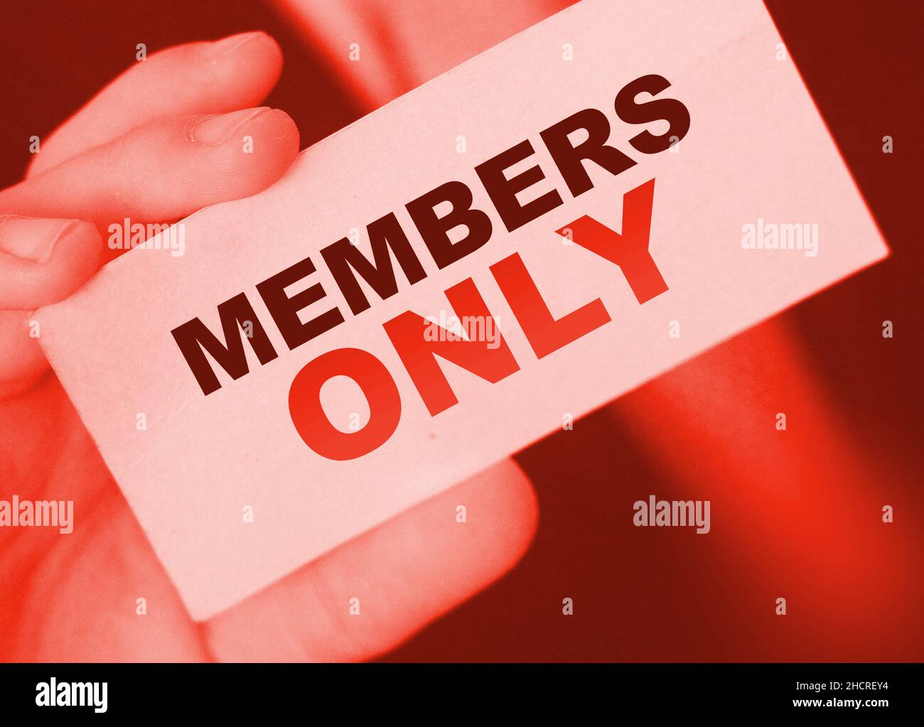MEMBERS ONLY on a card Businessman holds. VIP clients in business ...