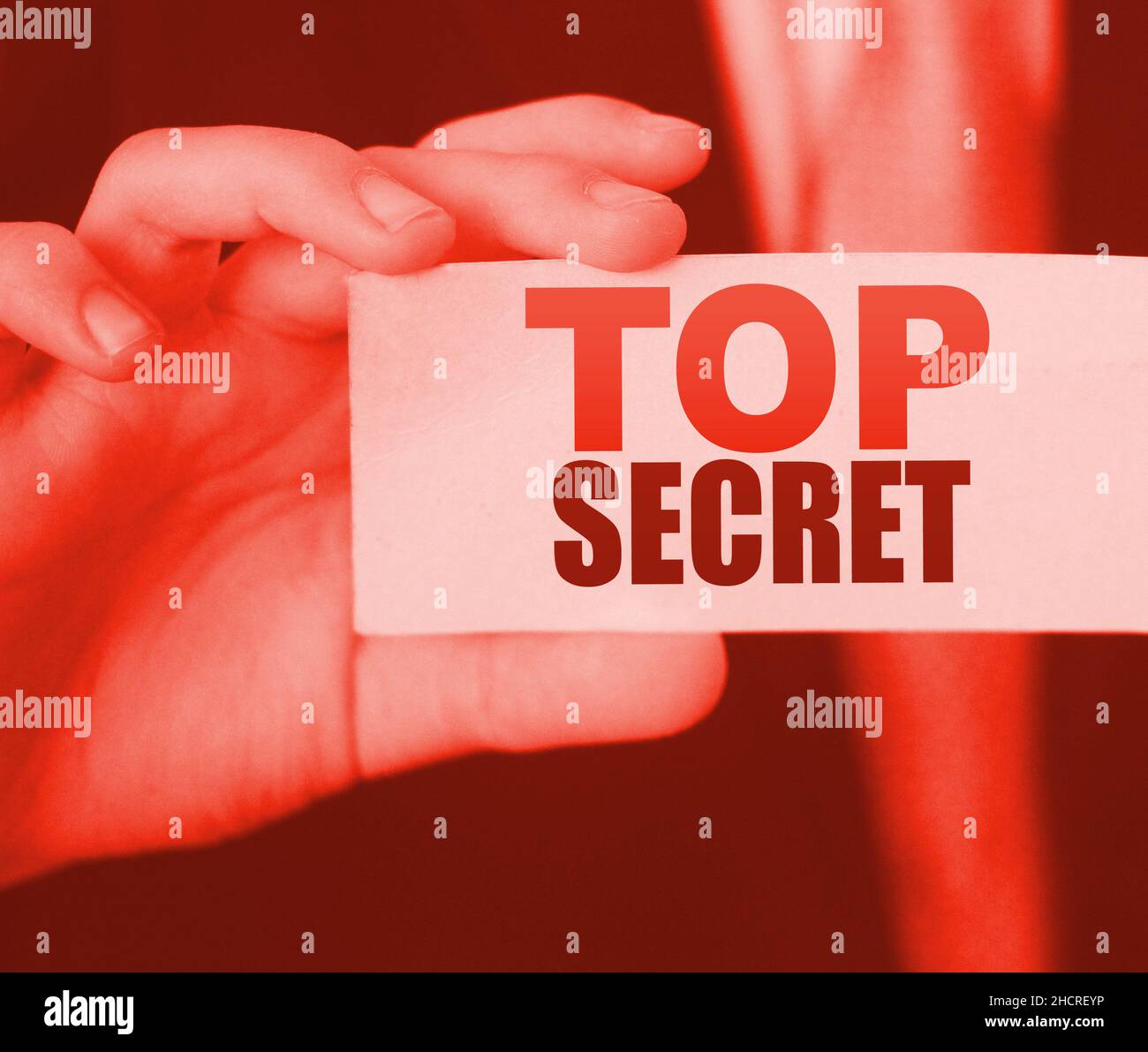 Businessman hand holding card with words Top Secrets. Business concept ...