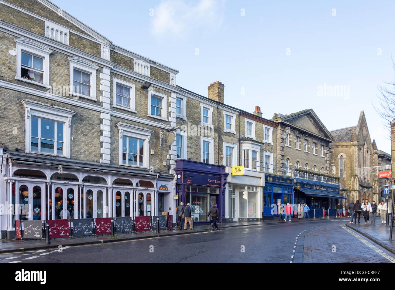 Restaurants shops rain raining street scene in winter jewry stre hi-res ...