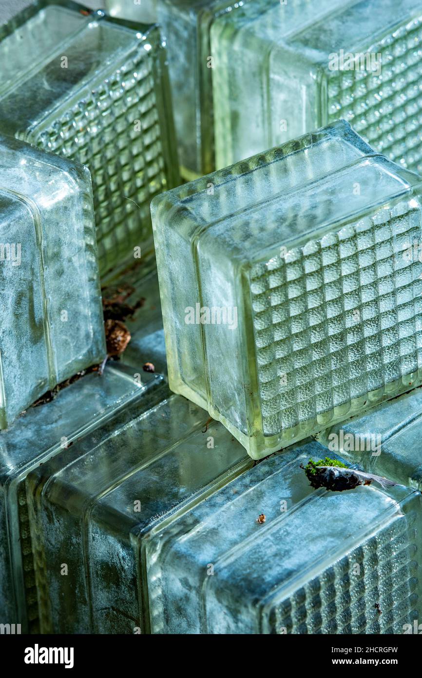 abstract glass bricks in a pile, glass window ricks or cubes in a stack ...