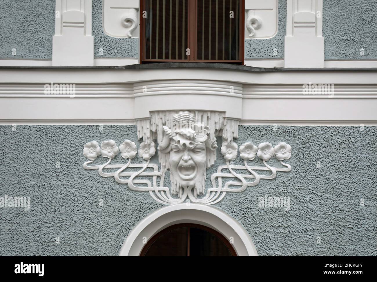 Decorative mascaron on the apartments built in 1902 in the art nouveau ...