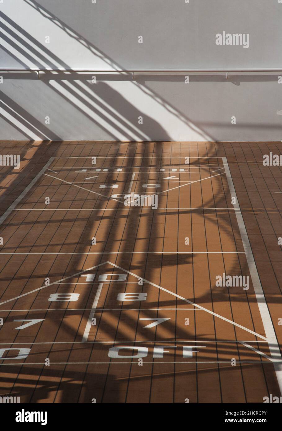 Abstract image with shadows of the shuffle board area on the deck of ...