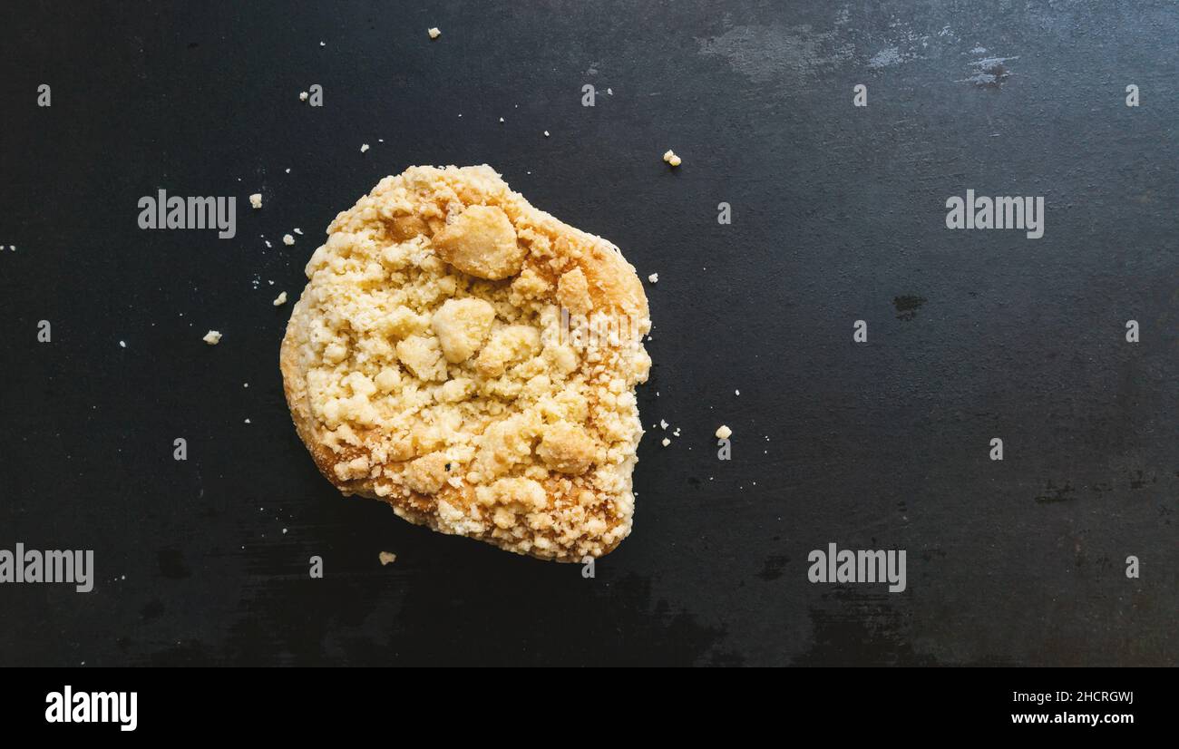 streusel bun or roll on old table, with copy space for individual text ...