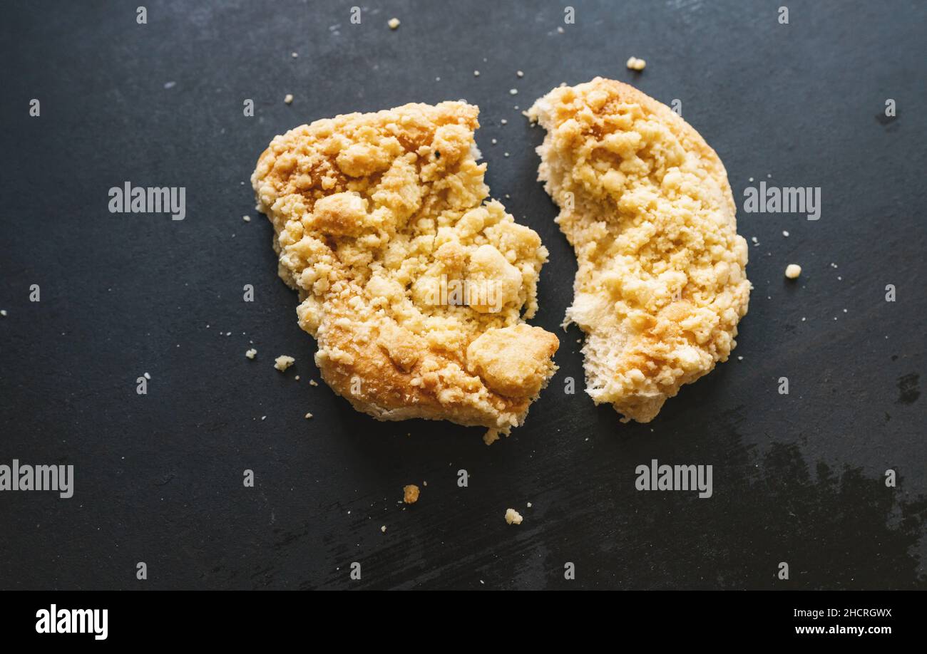 divided streusel bun or roll on old table Stock Photo - Alamy