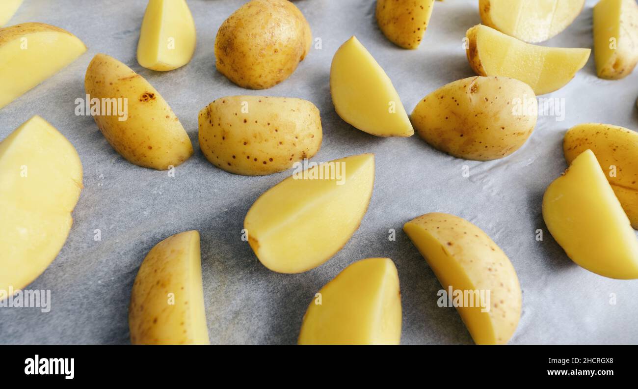 raw potato wedges on baking tray Stock Photo - Alamy