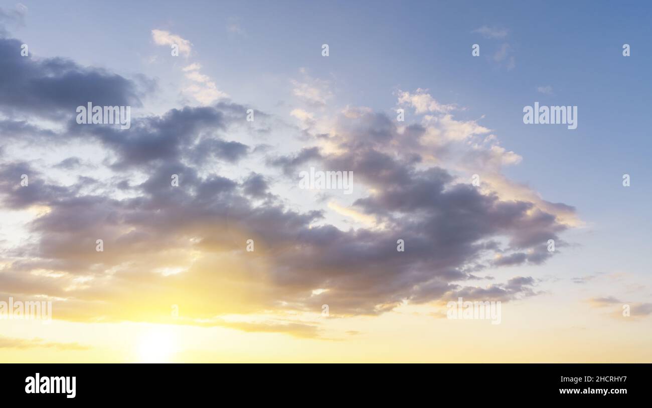 sunset clouds with sun setting down Stock Photo - Alamy