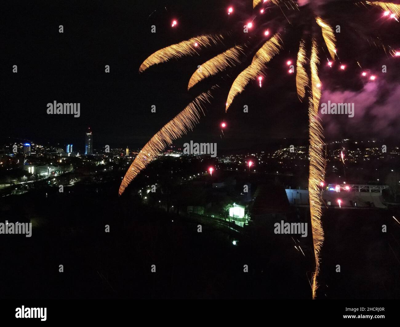 Jena, Germany. 31st Dec, 2021. Exploding firework rockets can be seen ...