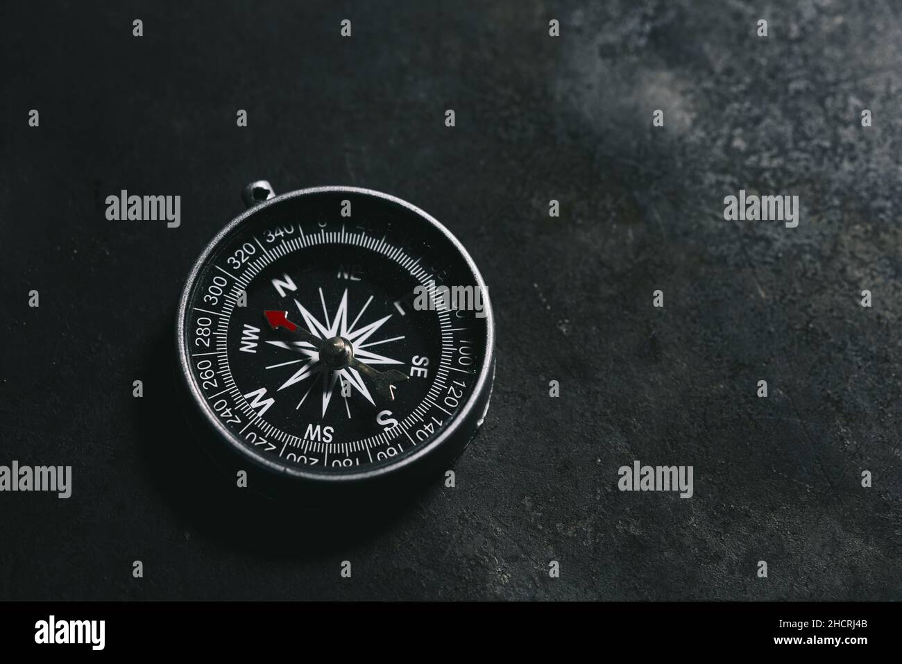 compass on a dark background concept for direction, travel, guidance or ...