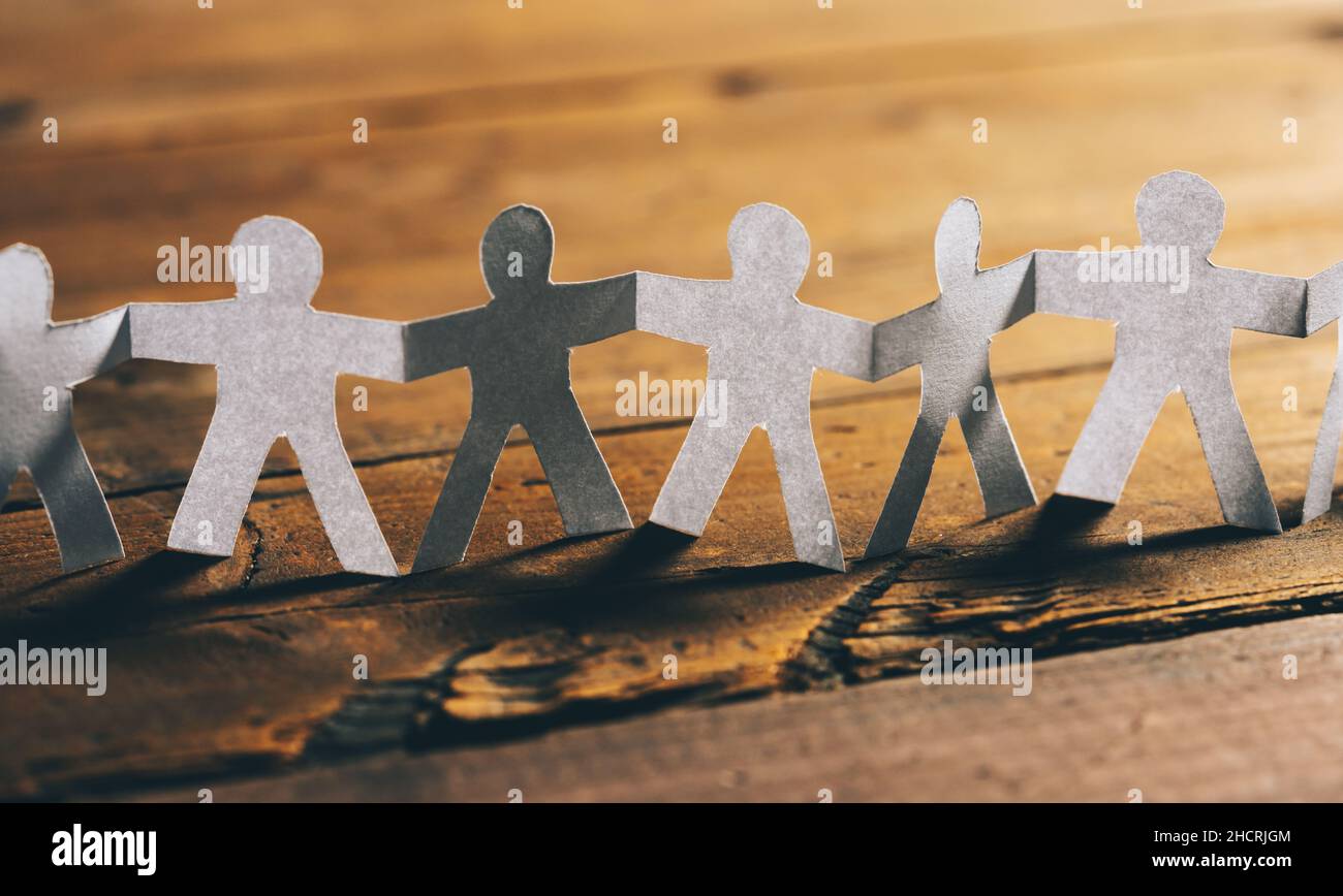 Paper People Holding Hands Stock Photo - Alamy