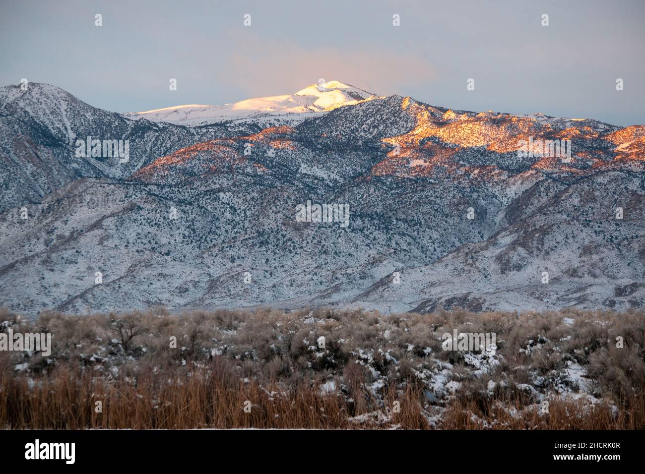 The Eastern Sierra peaks above Bishop, Inyo County, CA, USA light up ...