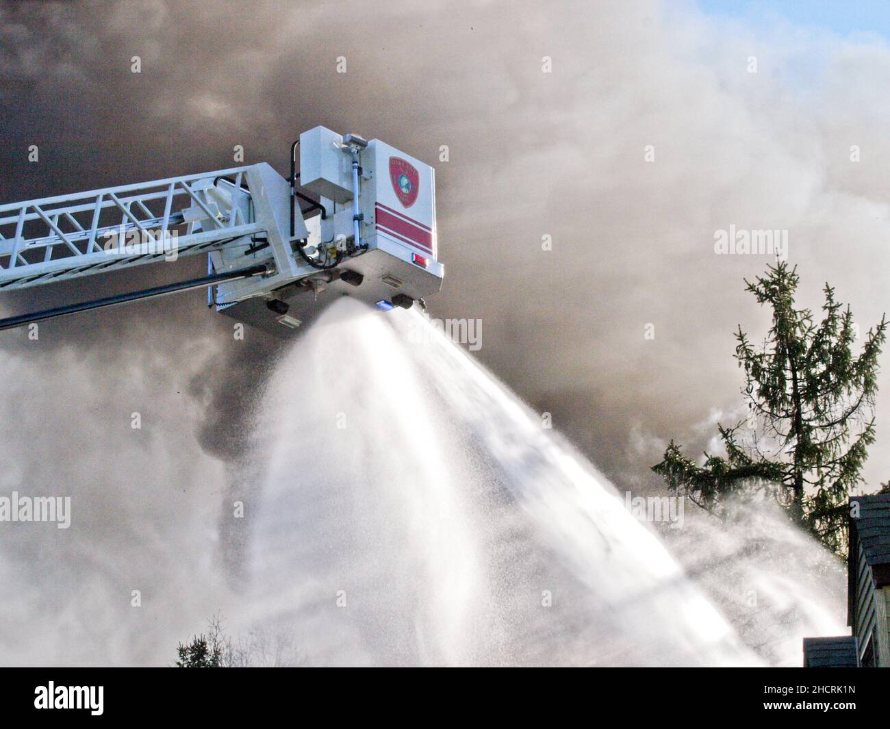 Firefighter at working fire with dramatic flames Stock Photo - Alamy