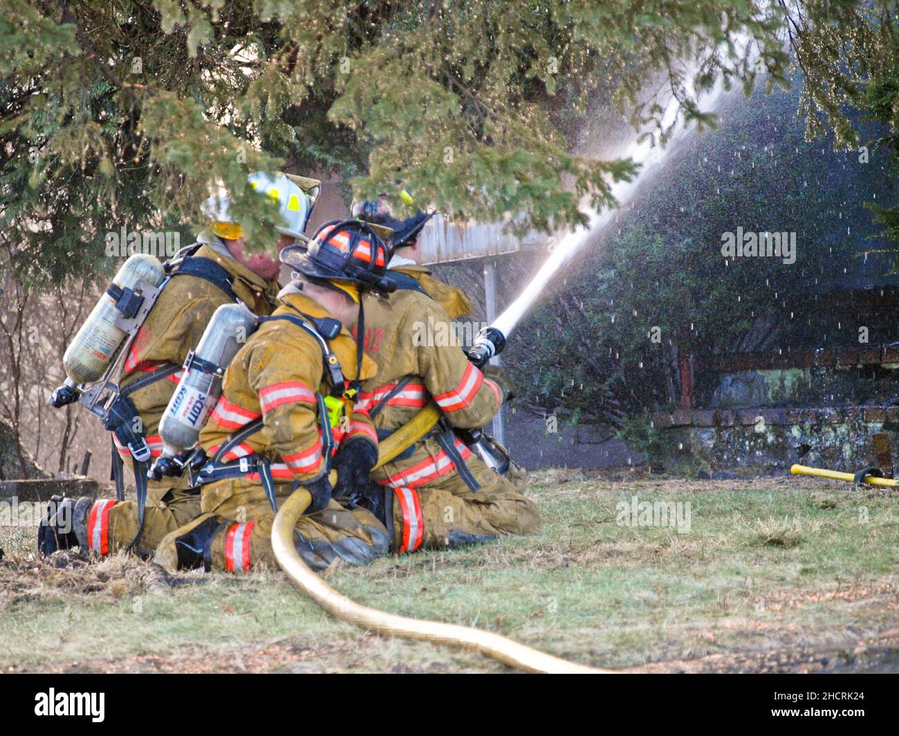 Firefighters on scene, smoke, no fire Stock Photo - Alamy