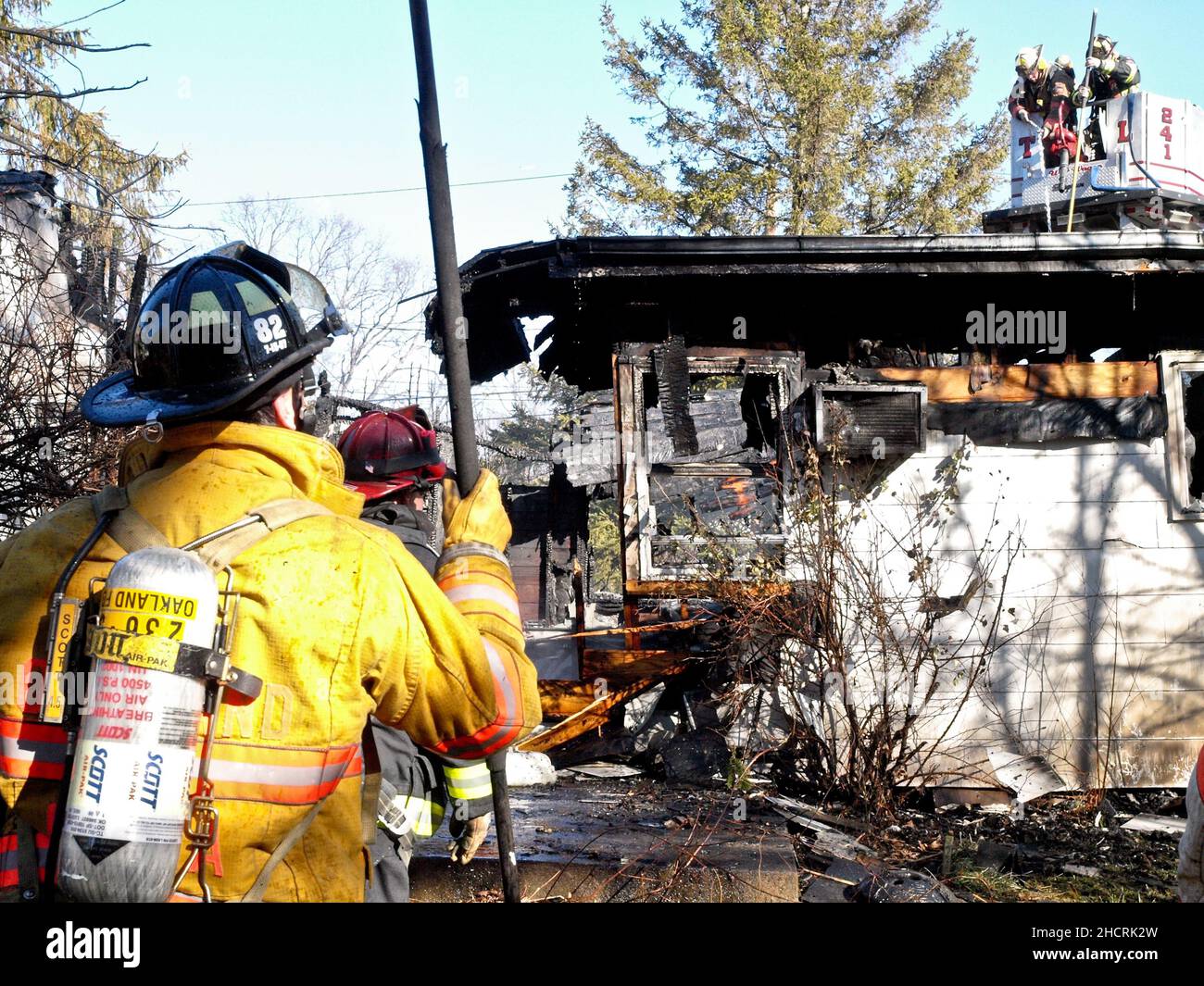 Aftermath of house fire, overhaul operations Stock Photo - Alamy