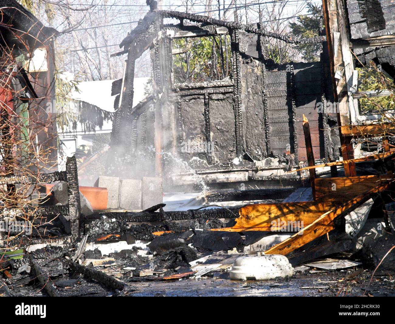Aftermath of house fire, overhaul operations Stock Photo - Alamy