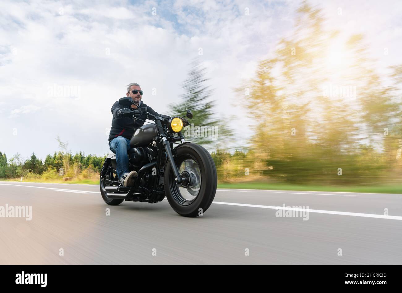 High power motorcycle chopper on the country road riding. having fun ...