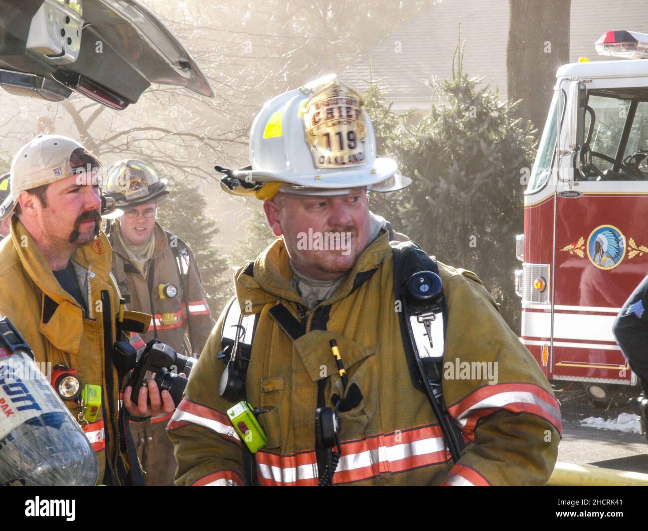 Firefighters on scene, smoke, no fire Stock Photo - Alamy
