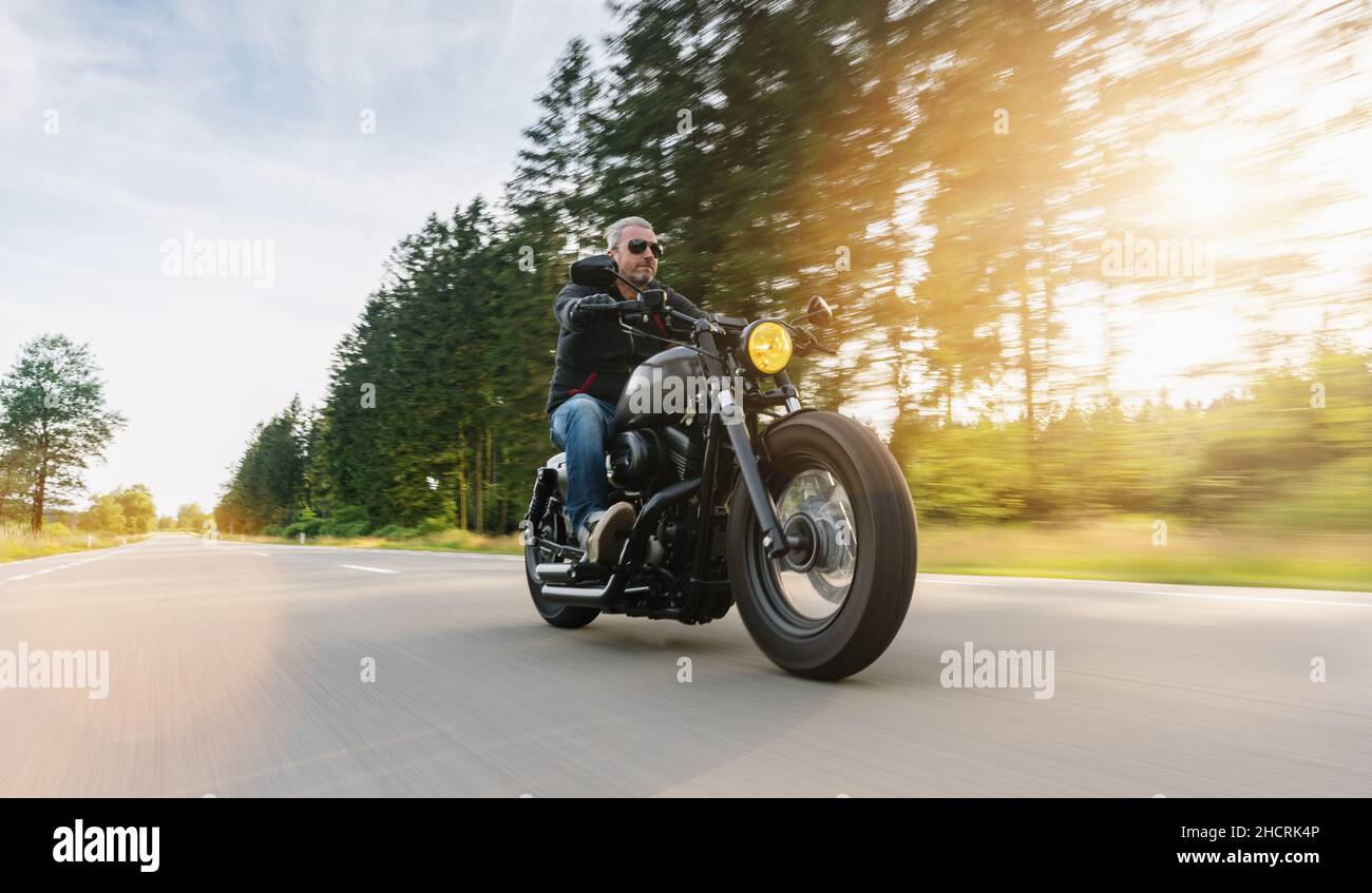 Man riding cafe racer motorcycle hi-res stock photography and images ...