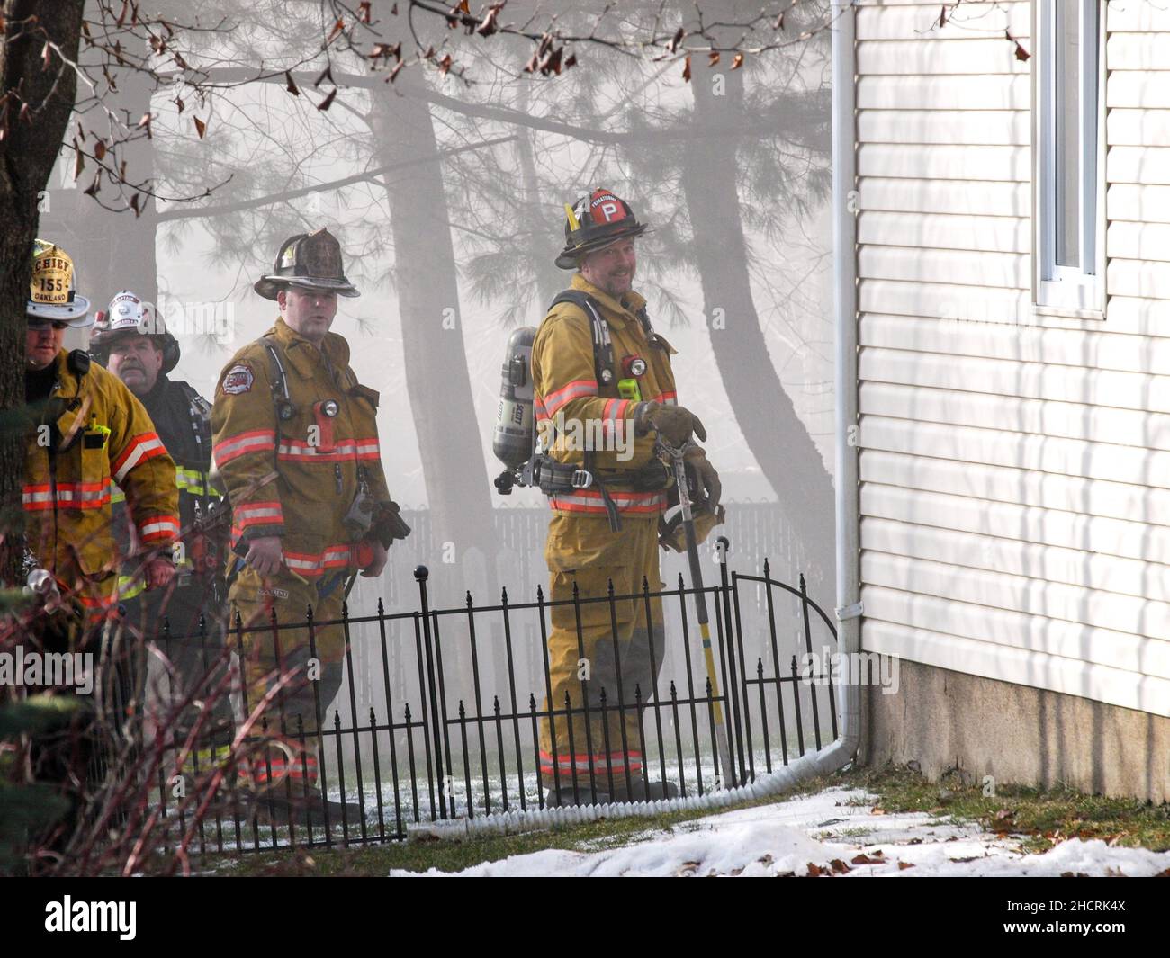 Firefighters on scene, smoke, no fire Stock Photo - Alamy