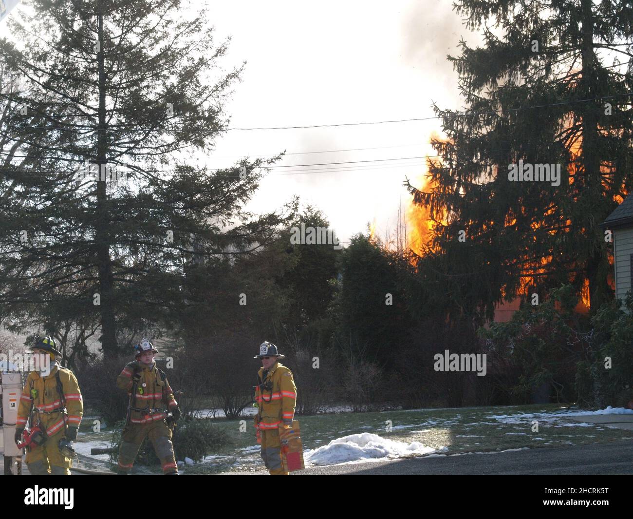 Firefighter at working fire with dramatic flames Stock Photo - Alamy