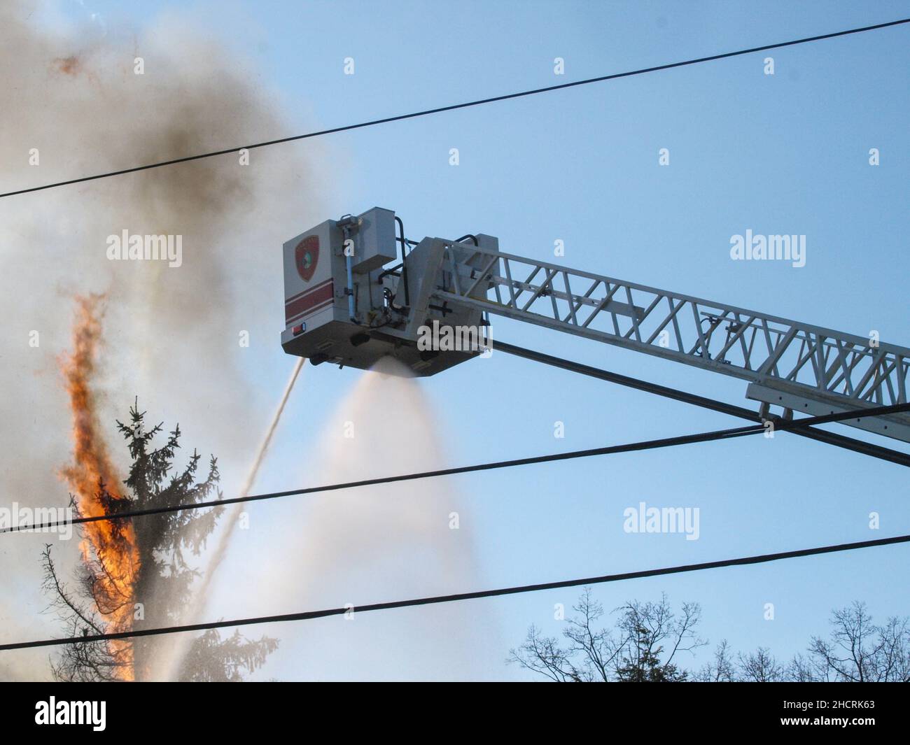 Firefighter at working fire with dramatic flames Stock Photo - Alamy