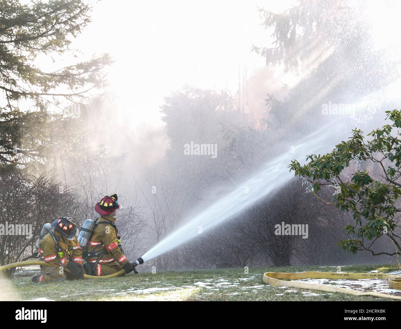 Firefighters on scene, smoke, no fire Stock Photo - Alamy