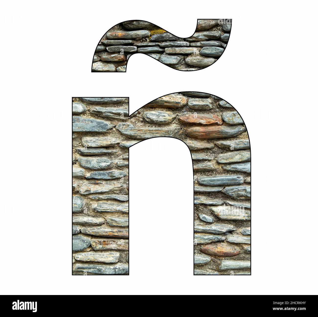 Alphabet letter ñ - Rustic stone background Stock Photo - Alamy