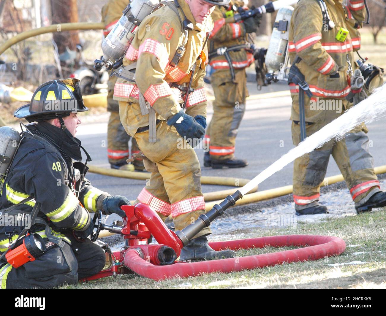 Firefighters on scene, smoke, no fire Stock Photo - Alamy