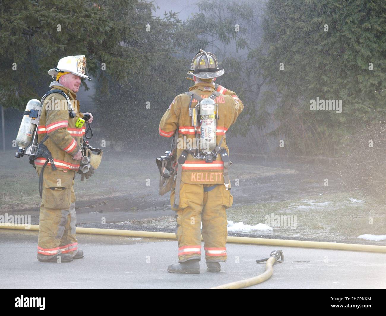 Firefighters on scene, smoke, no fire Stock Photo - Alamy