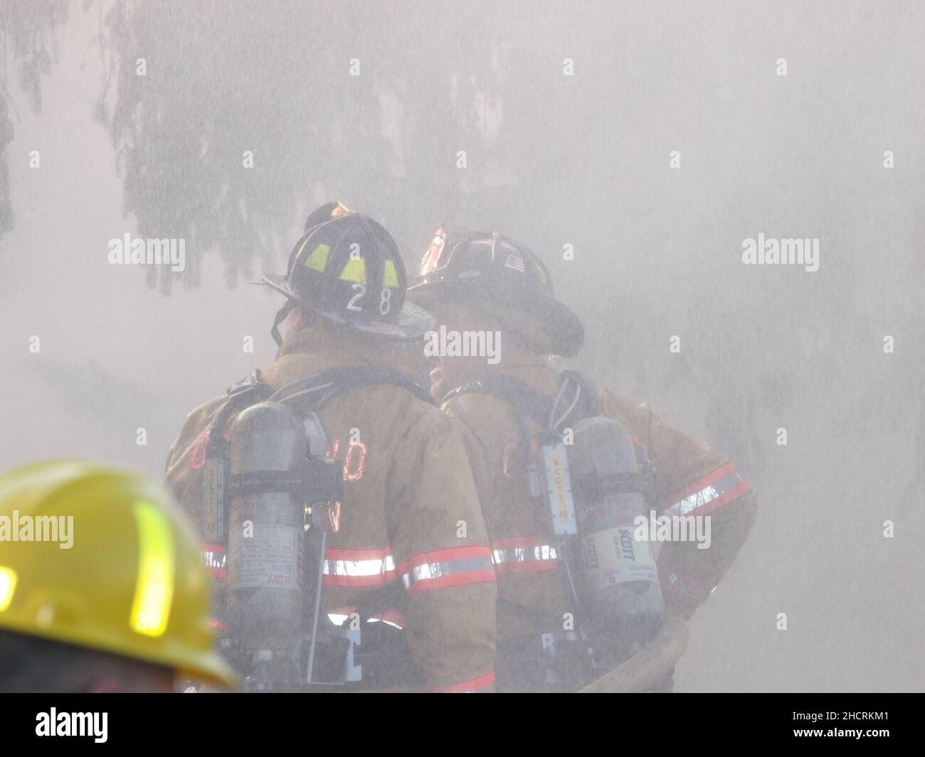 Firefighters on scene, smoke, no fire Stock Photo - Alamy