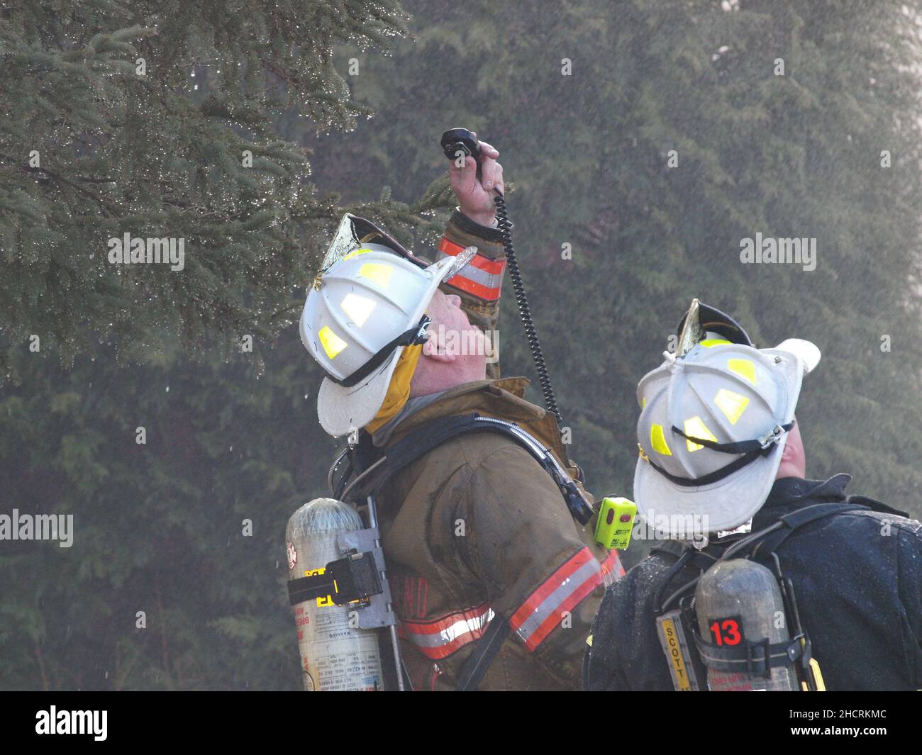 Firefighters on scene, smoke, no fire Stock Photo - Alamy