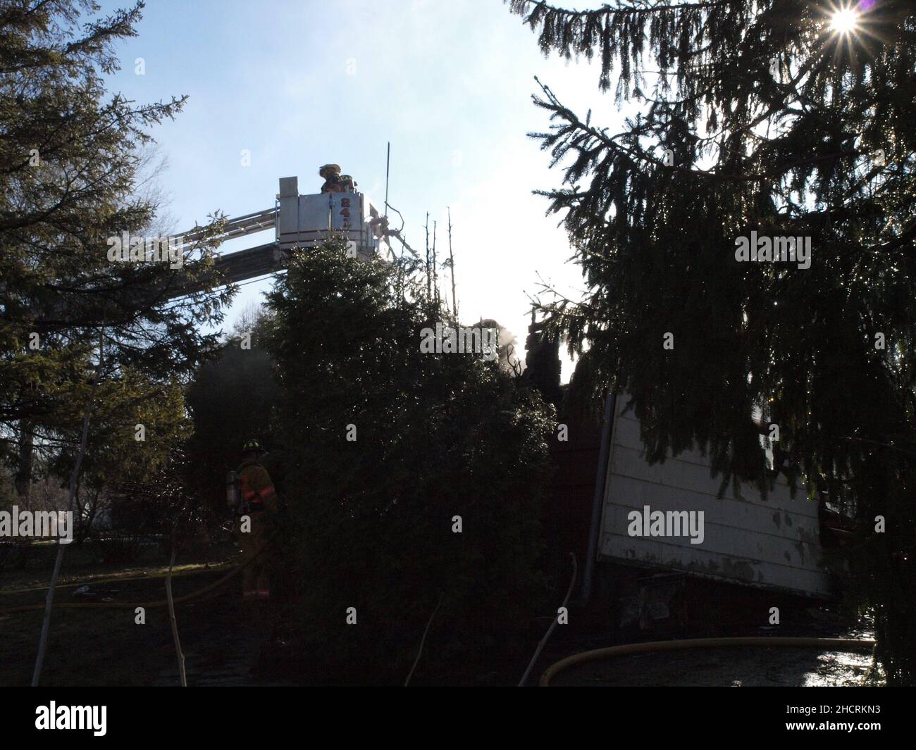 Aftermath of house fire, overhaul operations Stock Photo - Alamy