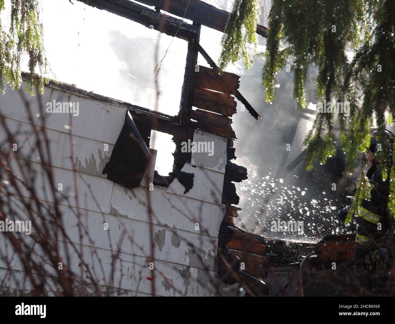 Aftermath of house fire, overhaul operations Stock Photo - Alamy