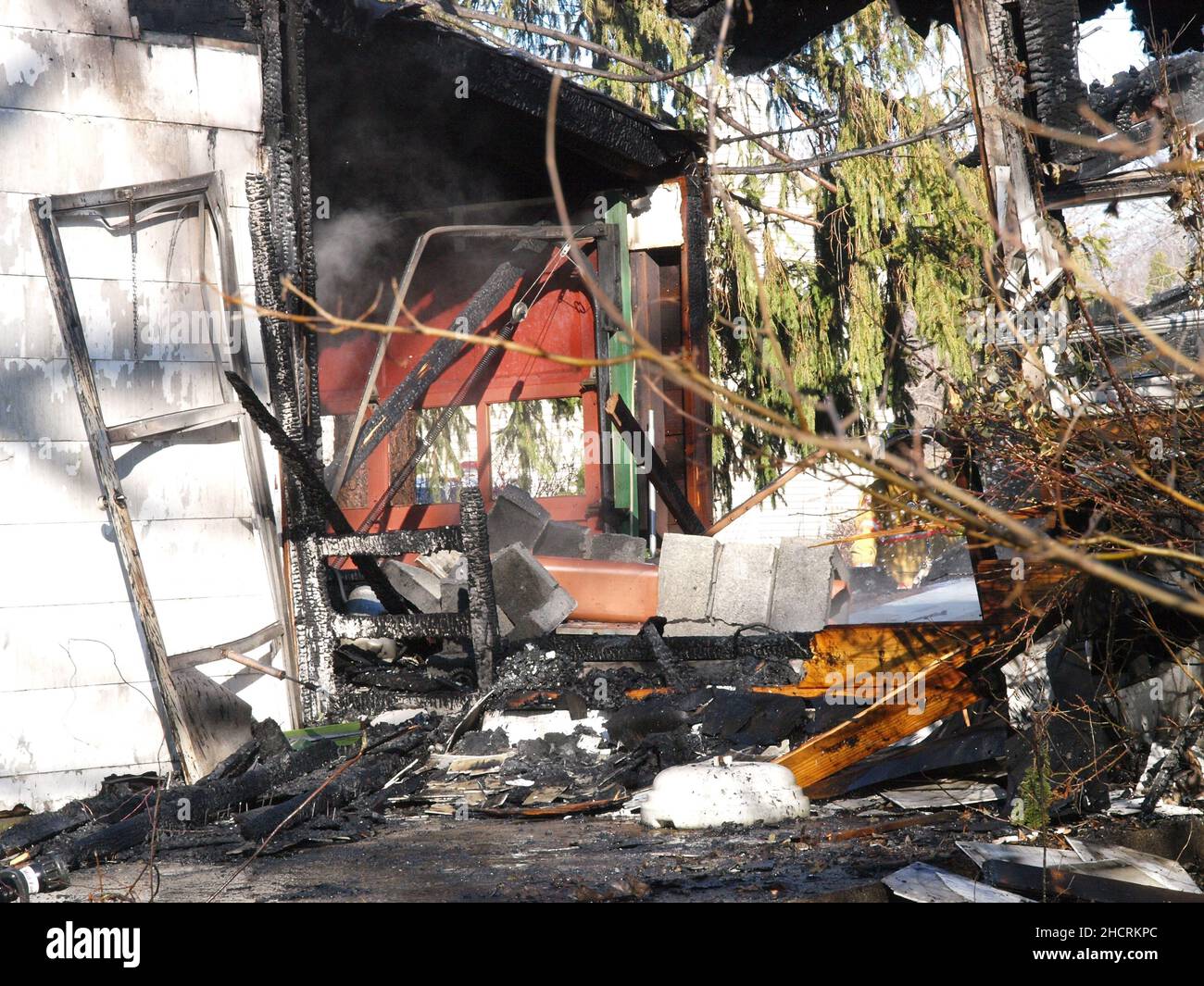 Aftermath of house fire, overhaul operations Stock Photo - Alamy