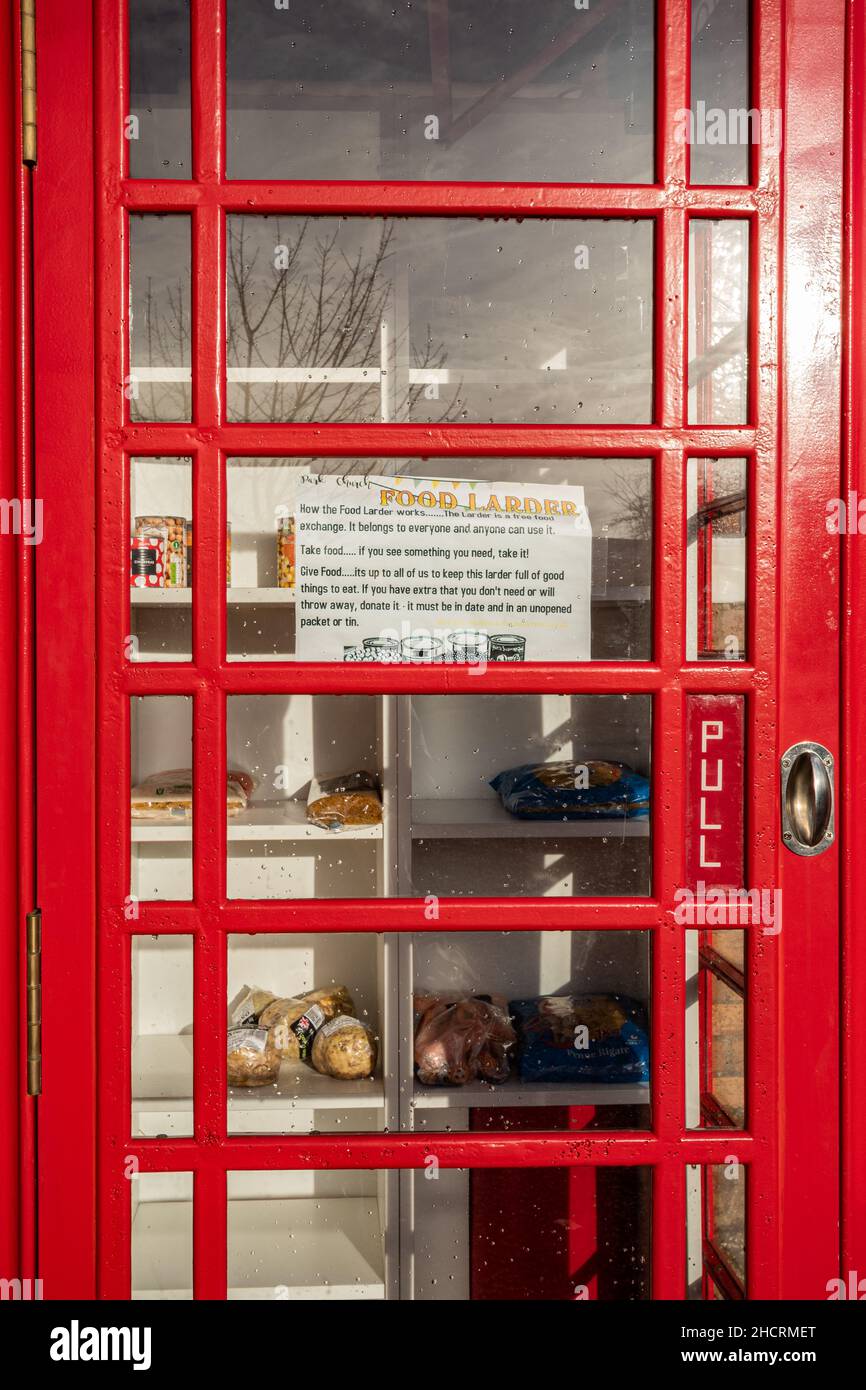 Food larder in an old red telephone box outside a church, Aldershot ...