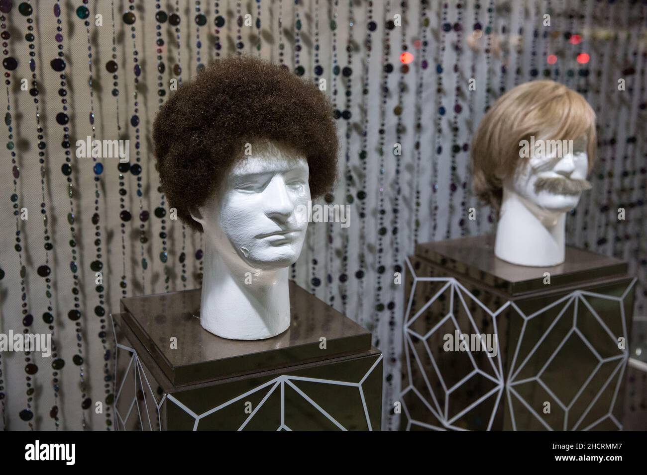 Mens Wigs in a Store Window Stock Photo - Alamy