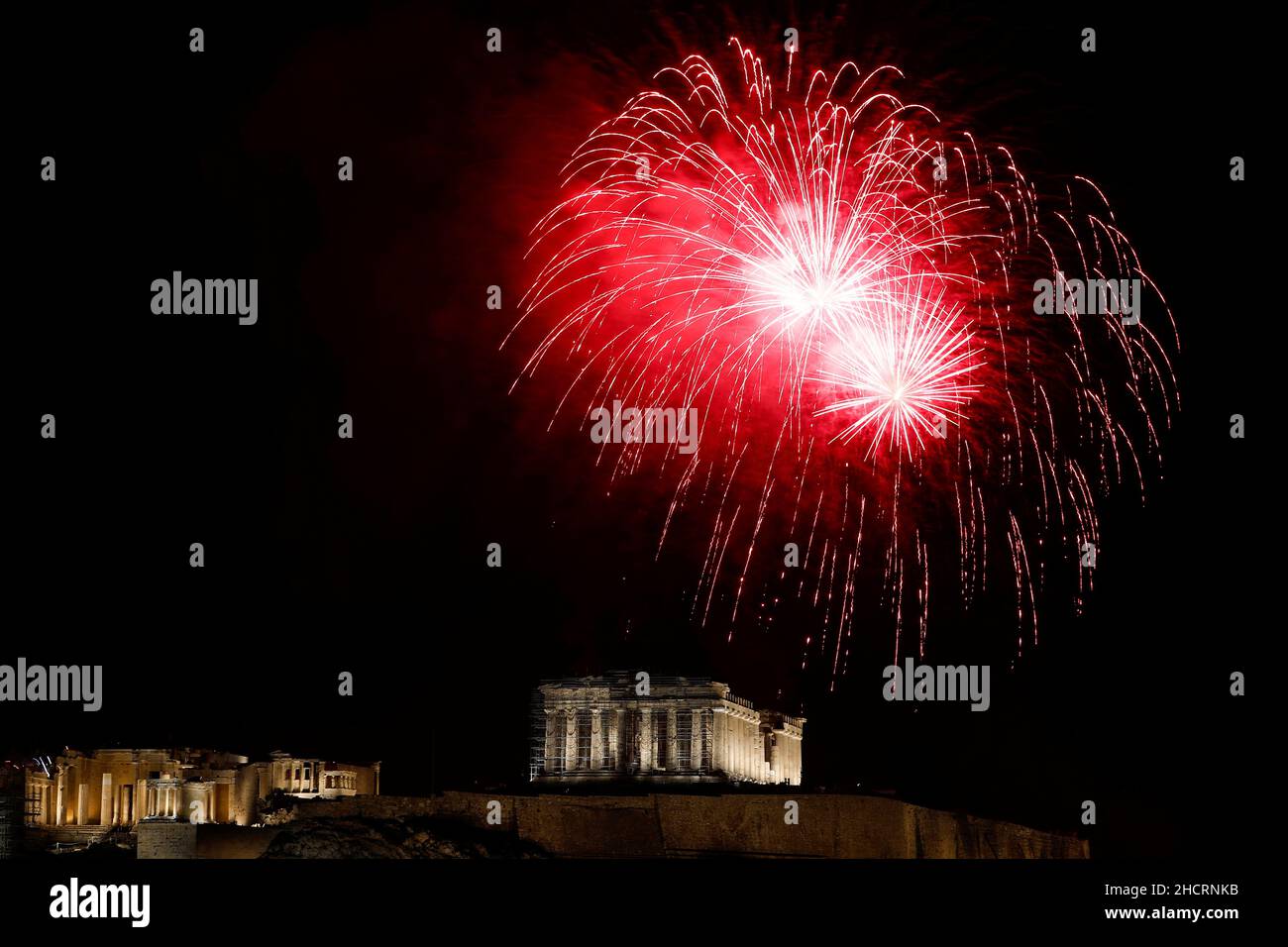 Fireworks explode over the ancient parthenon temple at the acropolis hi ...