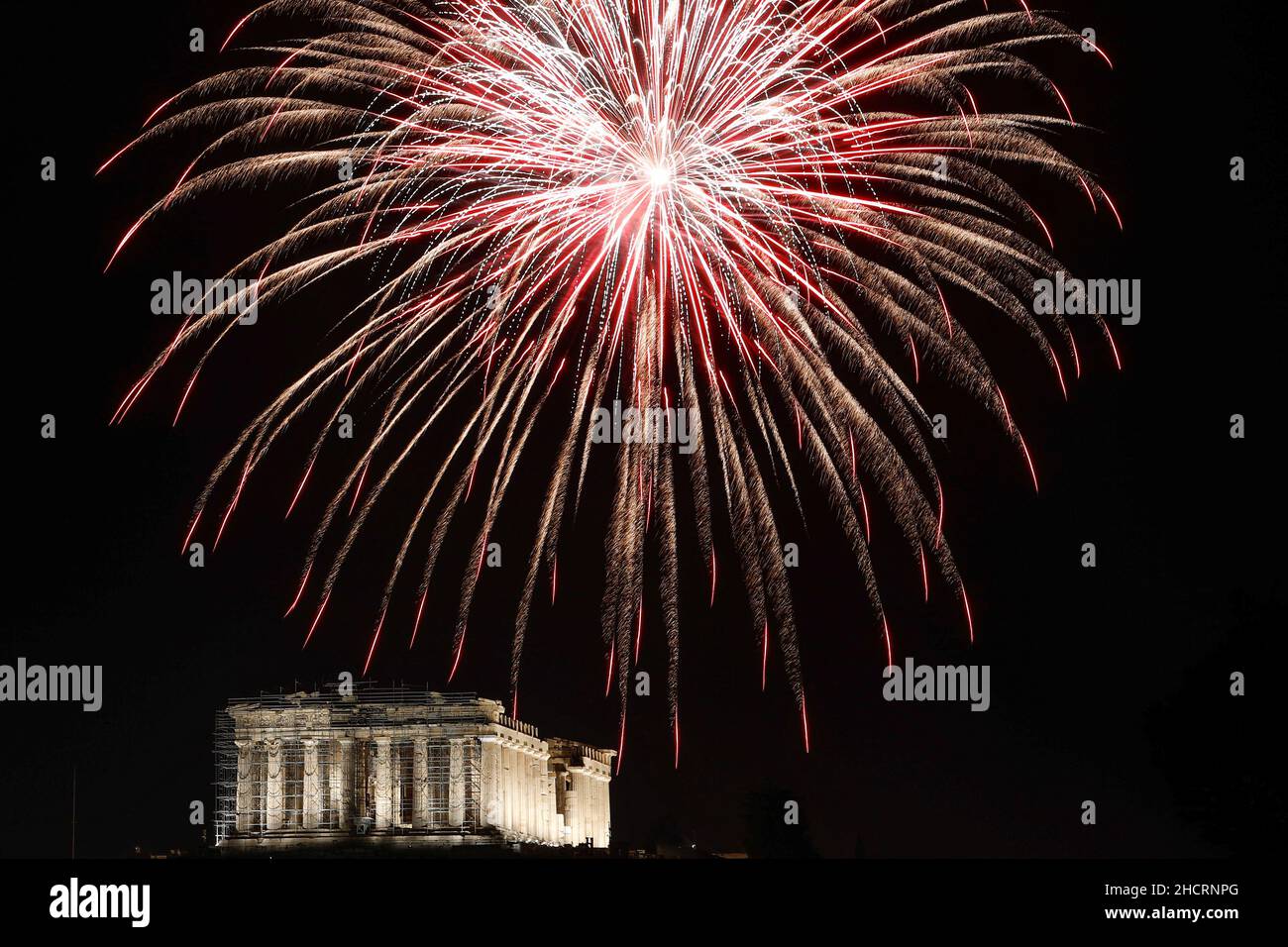 Fireworks explode over the ancient parthenon temple at the acropolis hi ...