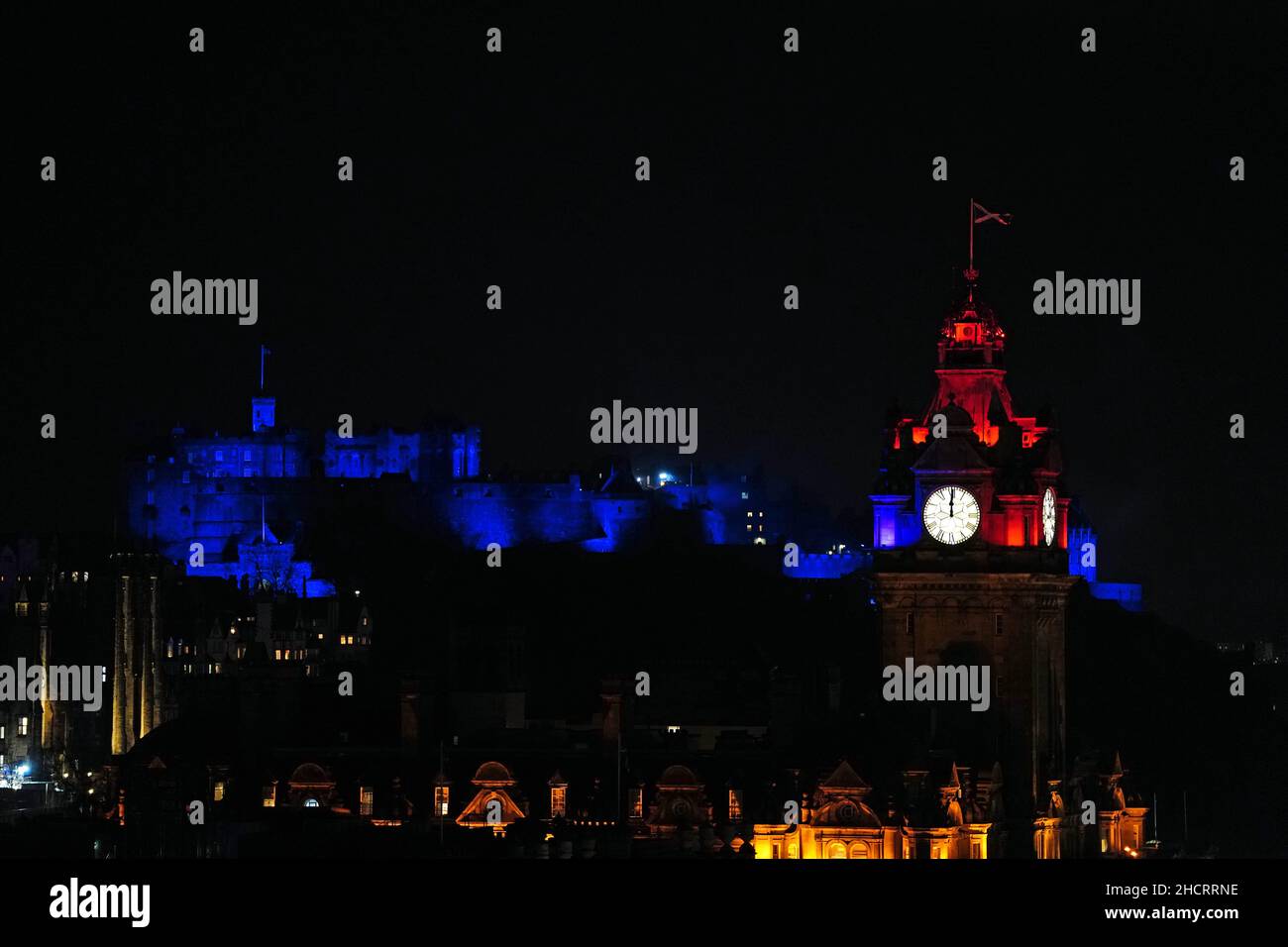 The Balmoral Hotel clock at midnight on New Year's Eve in Edinburghwith ...
