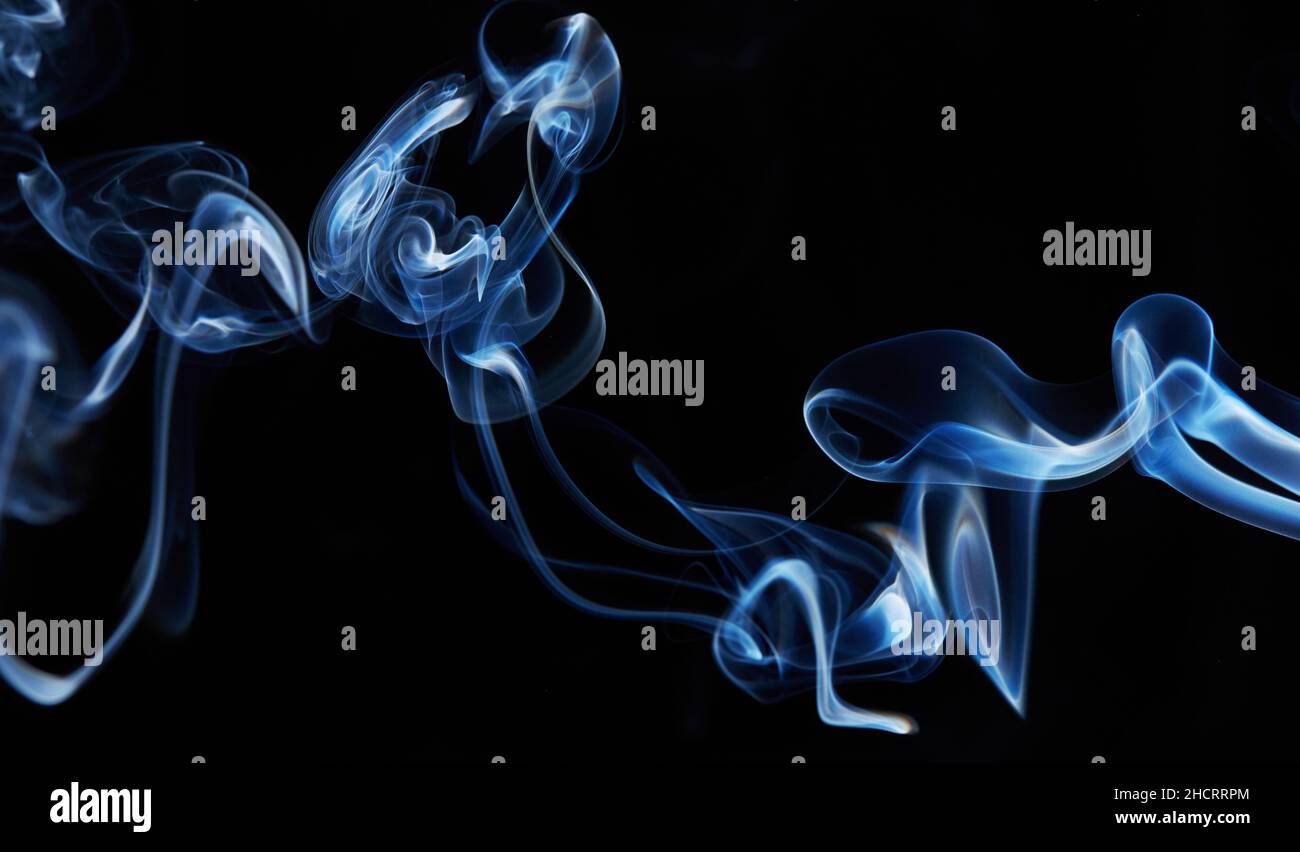 blue smoke on black background with abstract blur motion wave swirl ...