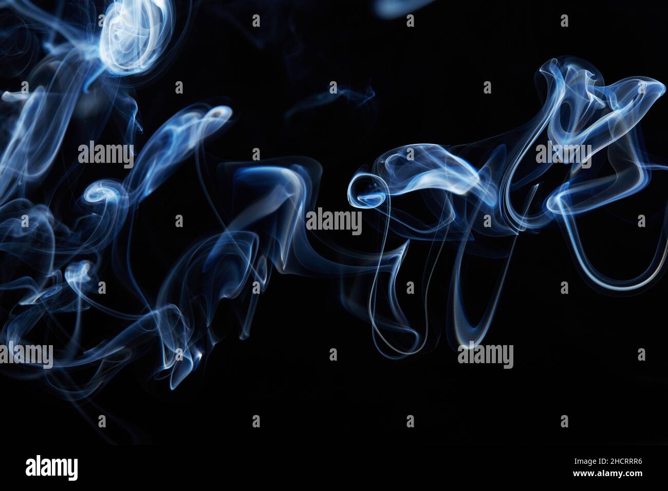 blue smoke on black background with abstract blur motion wave swirl ...