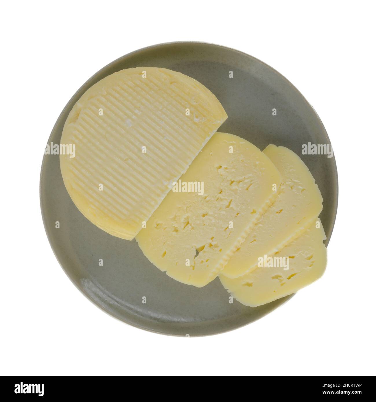 Round cheese on ceramic plate isolated on white background Stock Photo ...